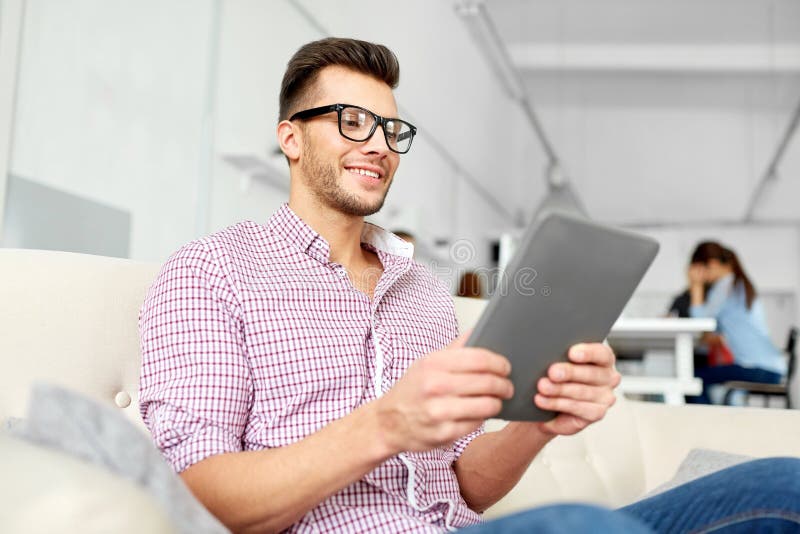 Man in Glasses with Tablet Pc Working at Office Stock Photo - Image of ...