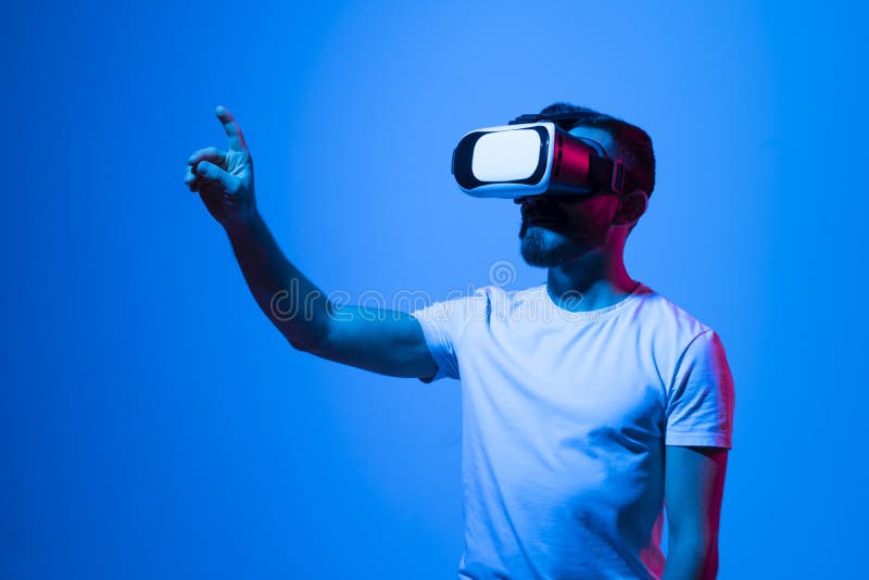 The Man with Glasses of Virtual Reality Playing a Games or Watching a ...
