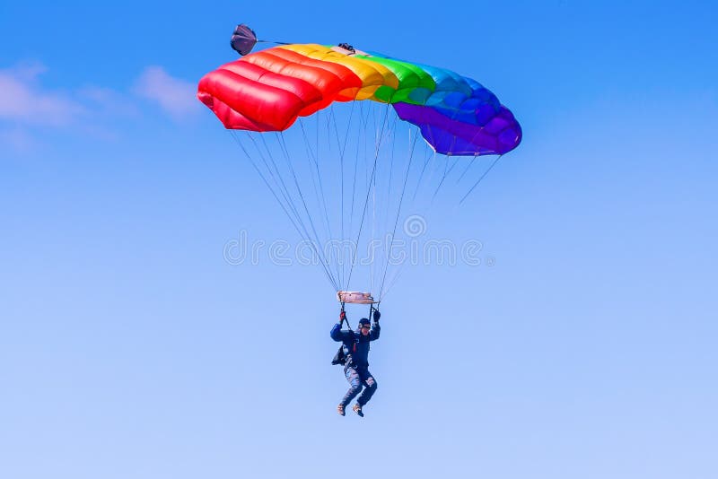 Man Gliding Down on a Parachute Stock Image - Image of danger, extreme ...