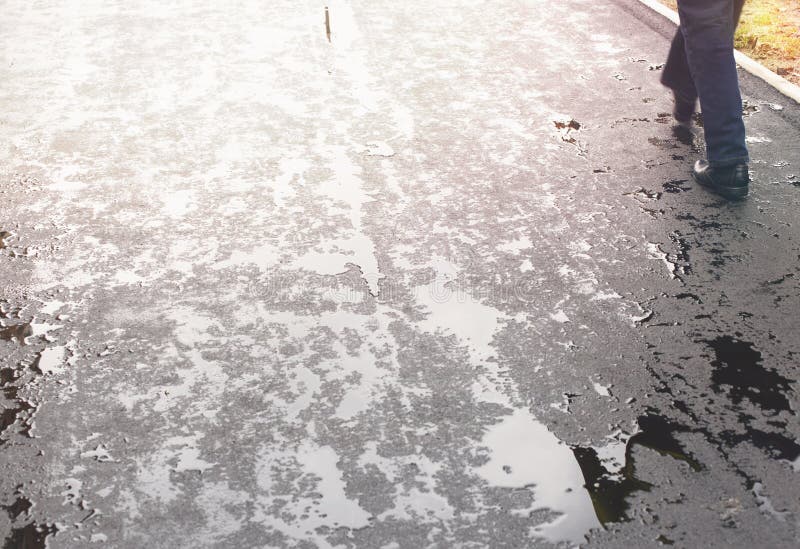 Man Goes on His Way on Wet Asphalt Road Stock Image - Image of intent ...