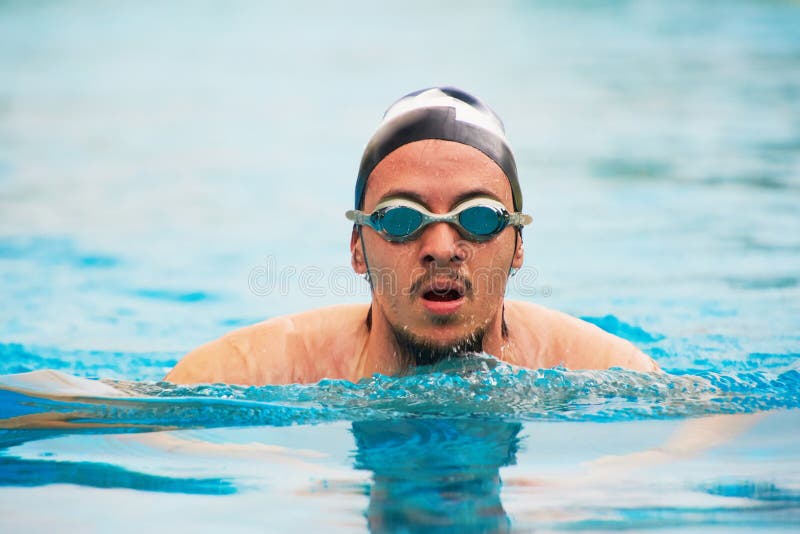 Hispanic man swim in pool stock image. Image of lifestyle - 113950061