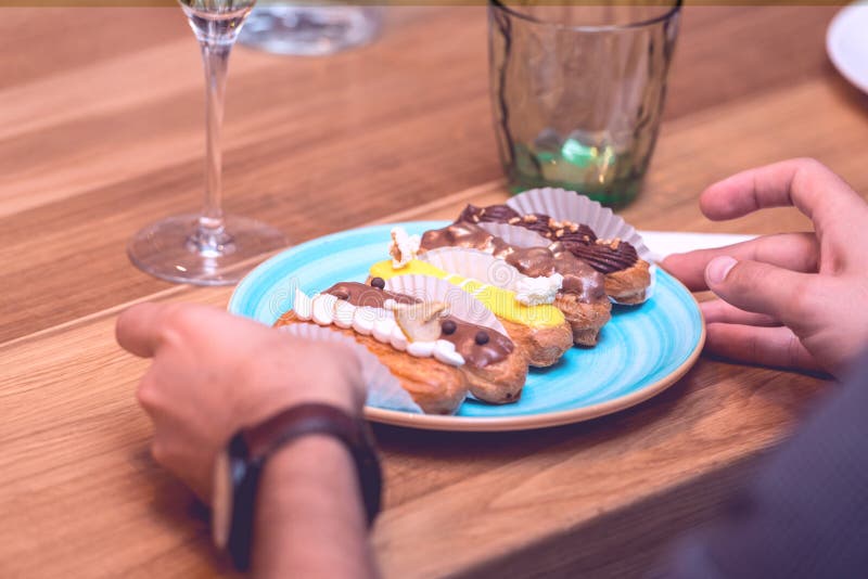 Man Going To Eat Eclait on a Food and Vine Tasting. Eclairs with Stock ...