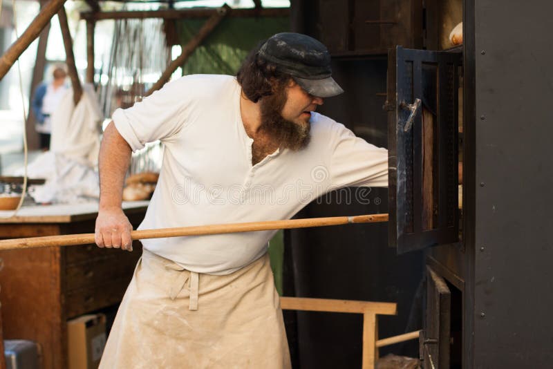 Man is Going To Take Out the Bread Out of the Oven Shovel Stock Image ...