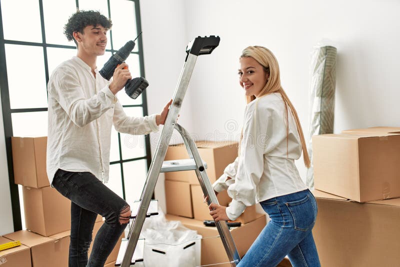 Man Going Up Ladder Holding Drill at New Home Stock Image - Image of ...