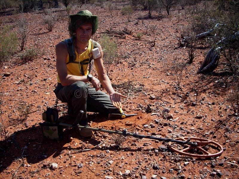 Man finding a gold nugget editorial stock image. Image of precious ...