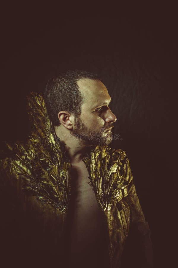Man with Golden Jacket and Large Feathers on His Lapel Stock Image ...