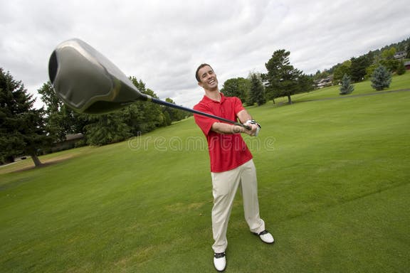 Man with Golf Club - Horizontal Stock Photo - Image of smiling, fairway ...