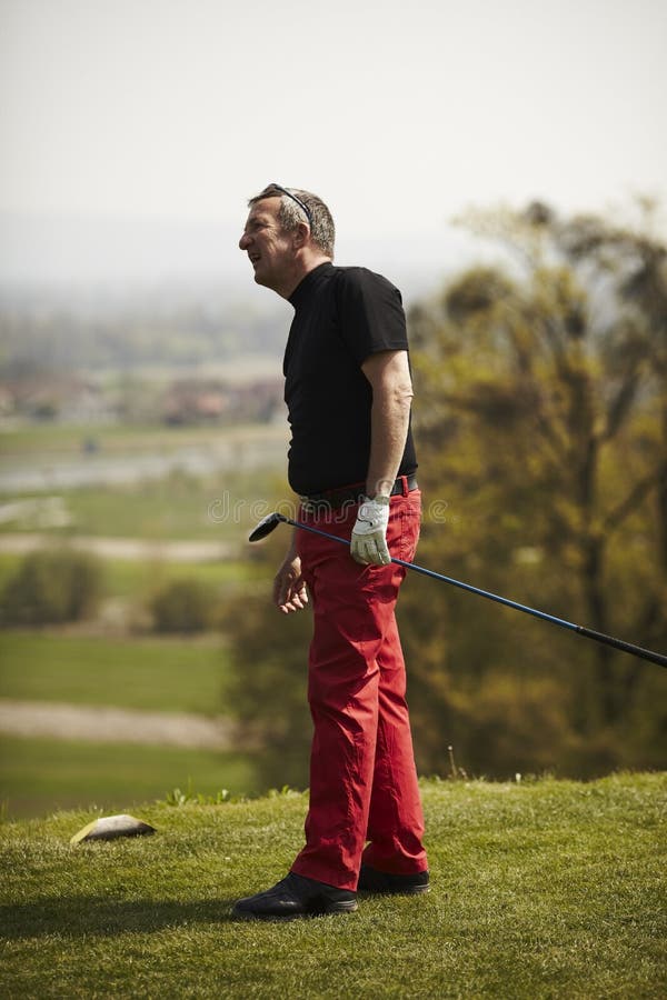 Man with Golf Club Waiting on the Green Stock Image - Image of measure ...