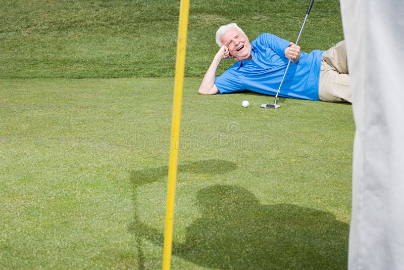 Man on a golf course stock image. Image of casual, grass - 62533837