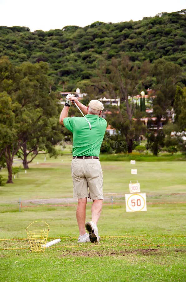 Man at the driving range stock photo. Image of club, driving - 3215598