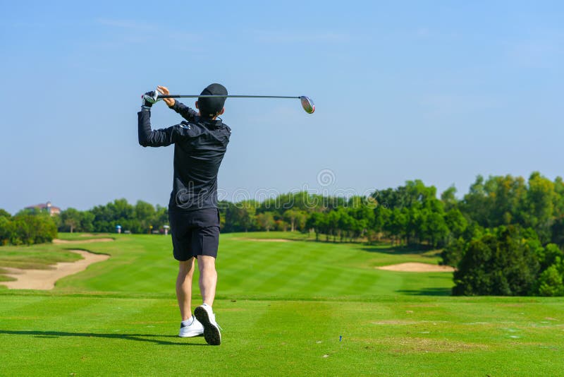 Man Golfer Hitting Ball with Club on Beatuiful Golf Course Stock Image ...