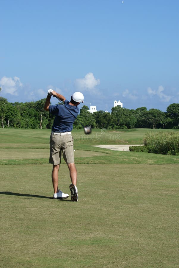 Two Men Golfing stock image. Image of mexico, sand, white - 11442619