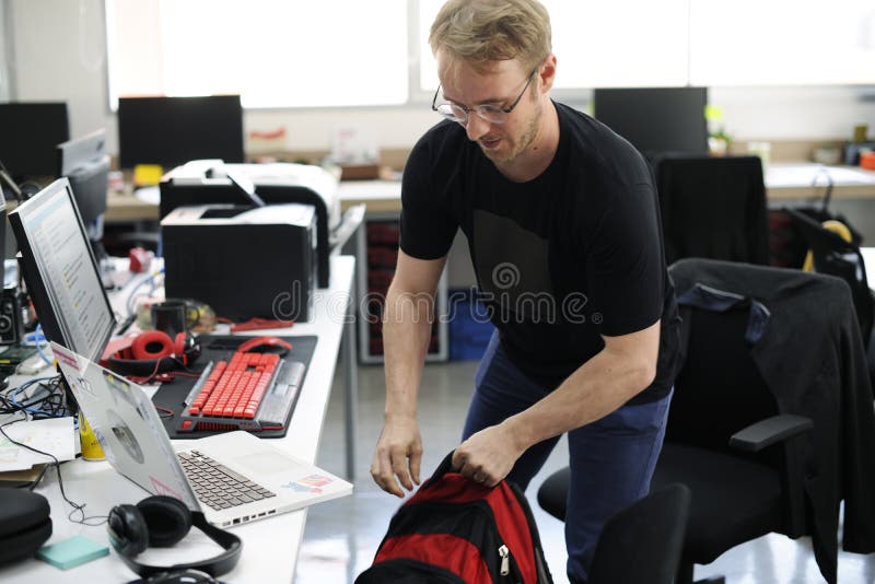 Man Grabbing Backpack Leaving after Work Hour Stock Image - Image of ...