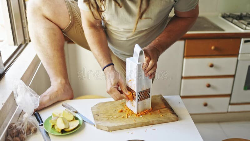 Man Grating Carrots in the Kitchen Stock Video - Video of dinner ...