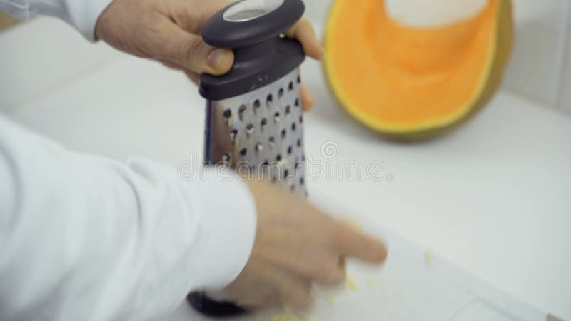 A Man is Grating Cheese on the Table. Stock Video - Video of cook ...