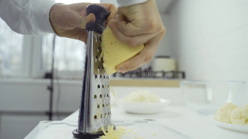 A Man is Grating Cheese on the Table. Stock Video - Video of delicious ...