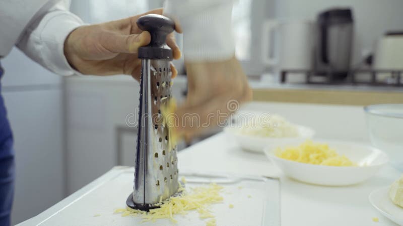 A Man is Grating Cheese on the Table. Stock Video - Video of gouda ...
