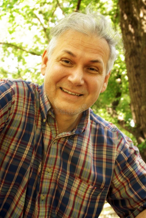 Man on Green Leaves Background Stock Photo - Image of senior, gray ...