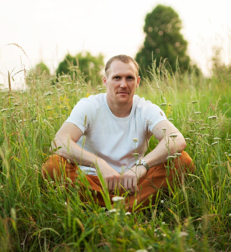 Man on Green Summer Meadow. Stock Image - Image of tranquil, grass ...