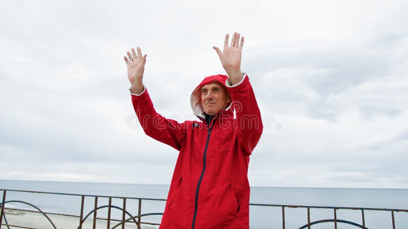 Man Greeting People with Both Hands Stock Photo - Image of male, clouds ...