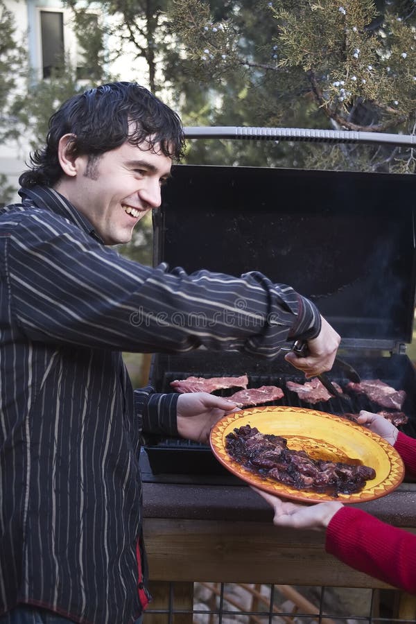 Man Grilling Meat on the Barbeque Stock Image - Image of handsome ...