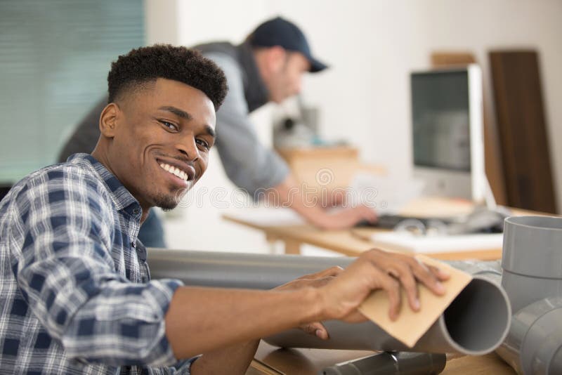 Man Grind Plastic Pipe with Sanding Paper Stock Photo - Image of ...
