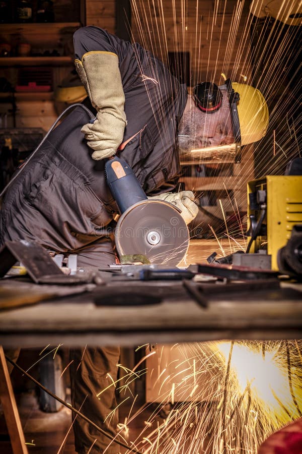 Man with grinder in action stock image. Image of spark - 133347097