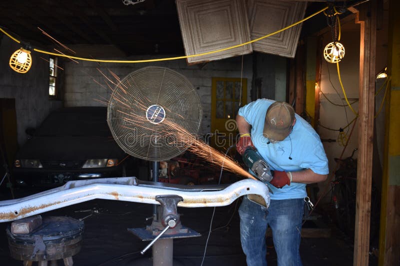 Man Grinding Car Bumper with Sparks Editorial Image - Image of ...