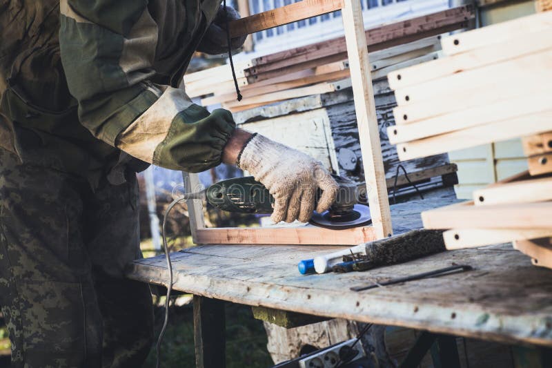 Man with Grinding Machine Makes Frame for Bees. Create Bee Frame with ...