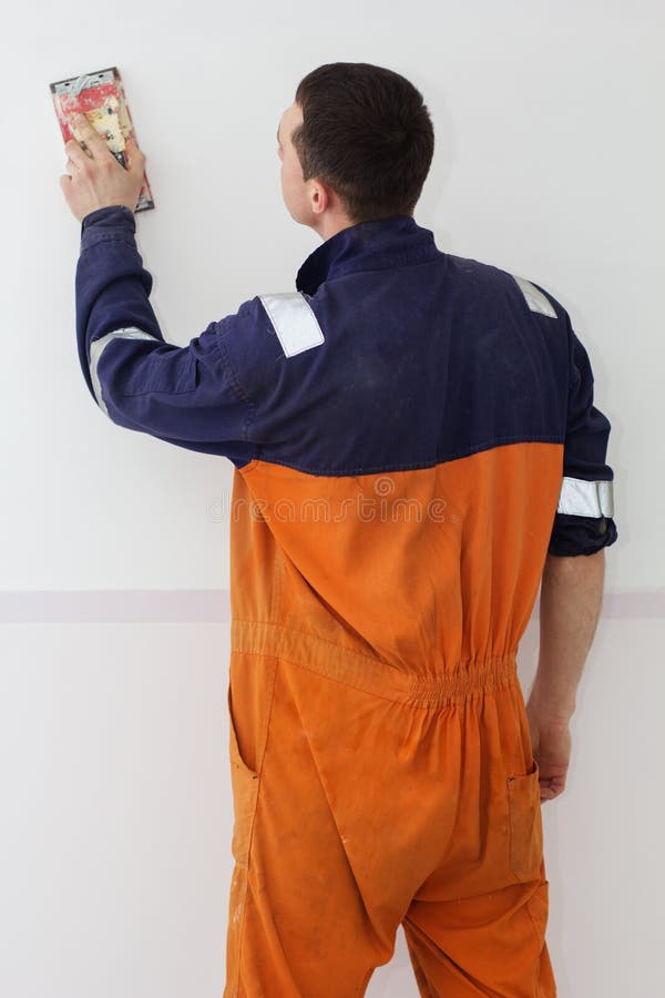 Man Grinding White Wall with Sandpaper Stock Image - Image of manual ...