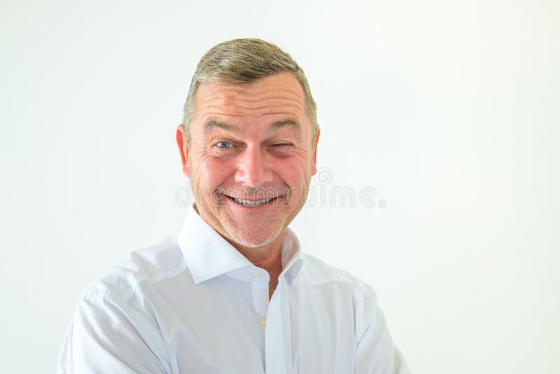 Man Grinning with Glee and Winking at the Camera Stock Photo - Image of ...