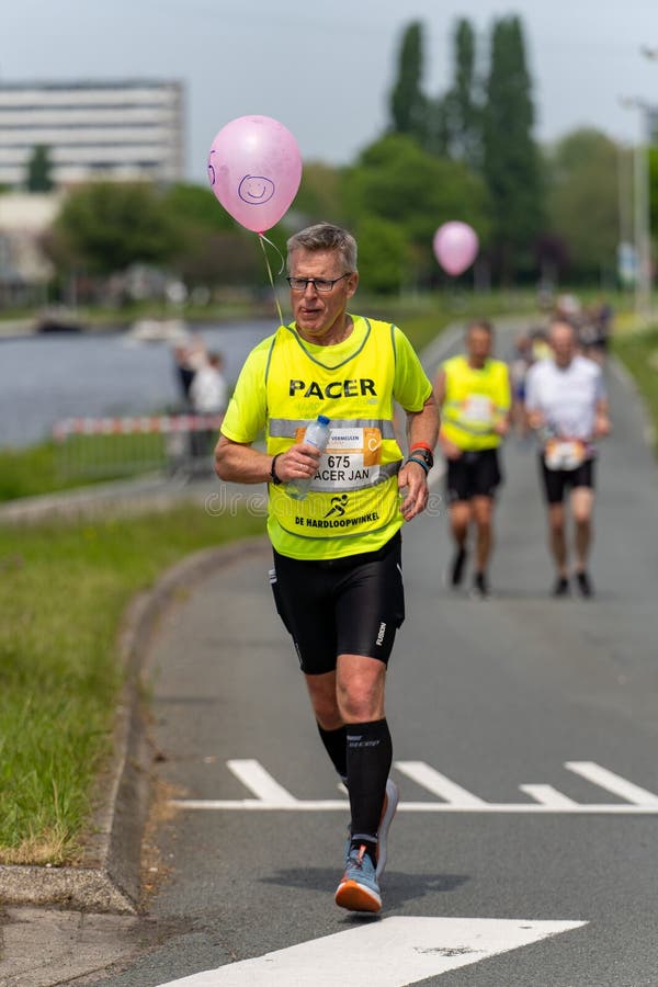Man with a Group of People Running in a Marathon Editorial Image ...