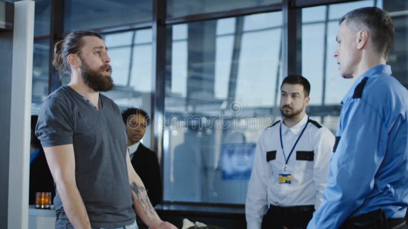 Airport Worker Checking Passenger with Metal Detector Stock Image ...