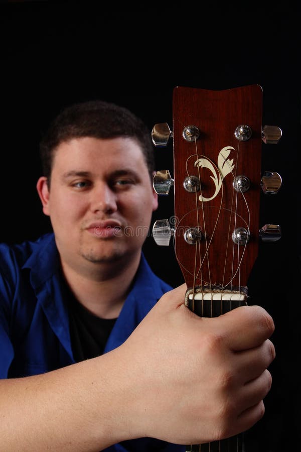 Man with Guitar right stock image. Image of neck, contemplating - 12513129