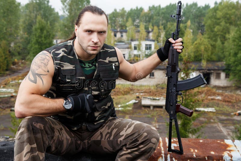 Man with a gun stock photo. Image of militias, muscular - 47252546