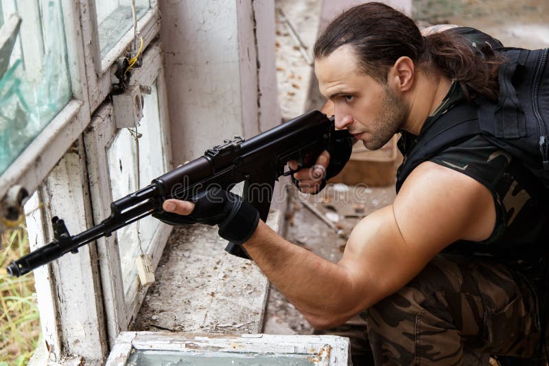 Man with a gun stock photo. Image of rifle, radical, issue - 47254510