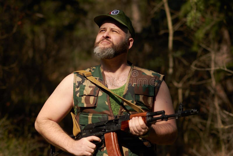 A Man with a Gun in a Forest Stock Photo - Image of prey, male: 185898918