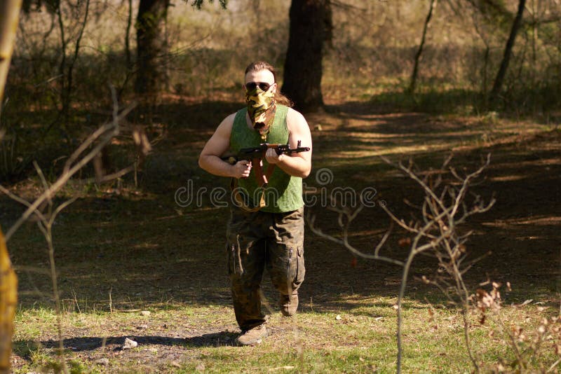 A Man with a Gun in a Forest Stock Image - Image of charge, sport ...