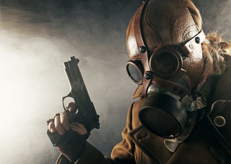 Man with gun in gas mask stock photo. Image of glove - 22730598