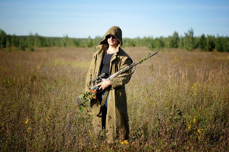 A Man with a Gun in His Hands.Back View Stock Photo - Image of snaper ...