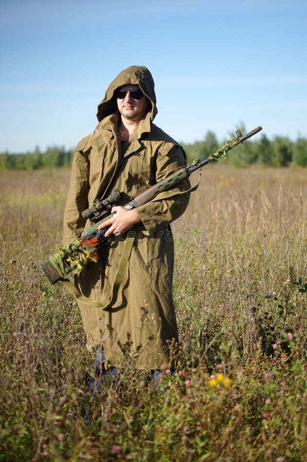 A Man with a Gun in His Hands.Back View Stock Photo - Image of snaper ...