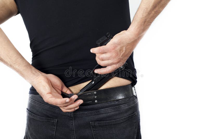 A man with a gun his pants stock image. Image of holding - 54808813