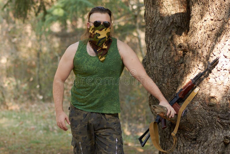 A Man with a Gun in a Forest Stock Photo - Image of sport, kill: 185899040