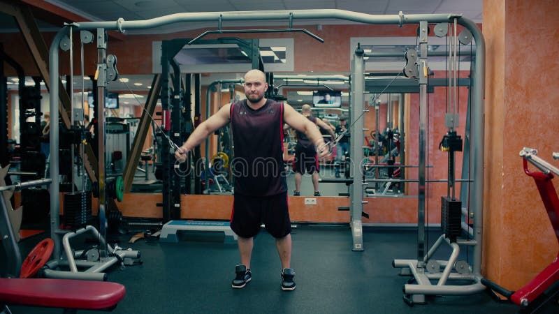 Man in Gym Doing Pulls Weight on Cable Machine Stock Video - Video of ...