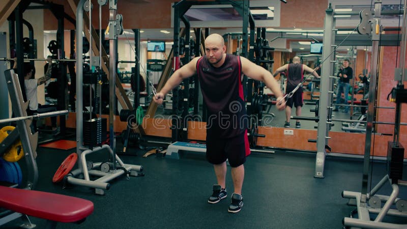 Man in Gym Doing Pulls Weight on Cable Machine Stock Video - Video of ...