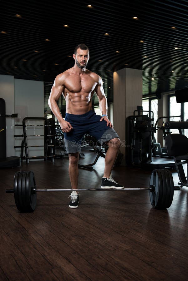 Man in the Gym Exercising Back with Barbell Stock Image - Image of ...