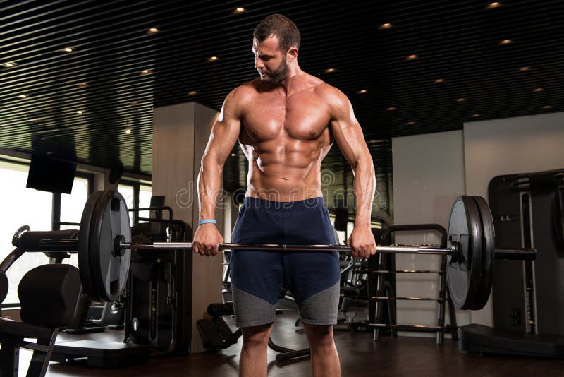 Man in the Gym Exercising Back with Barbell Stock Photo - Image of back ...