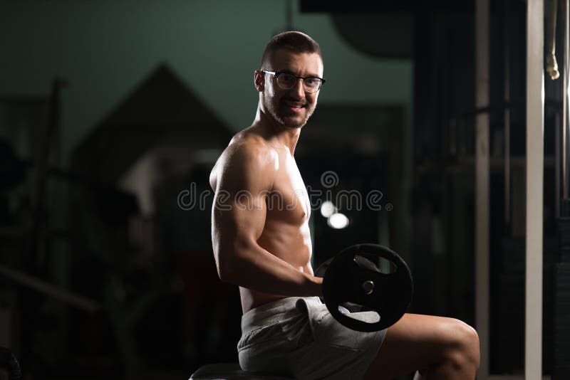 Geek Man with Barbell Exercising Biceps Stock Image - Image of male ...
