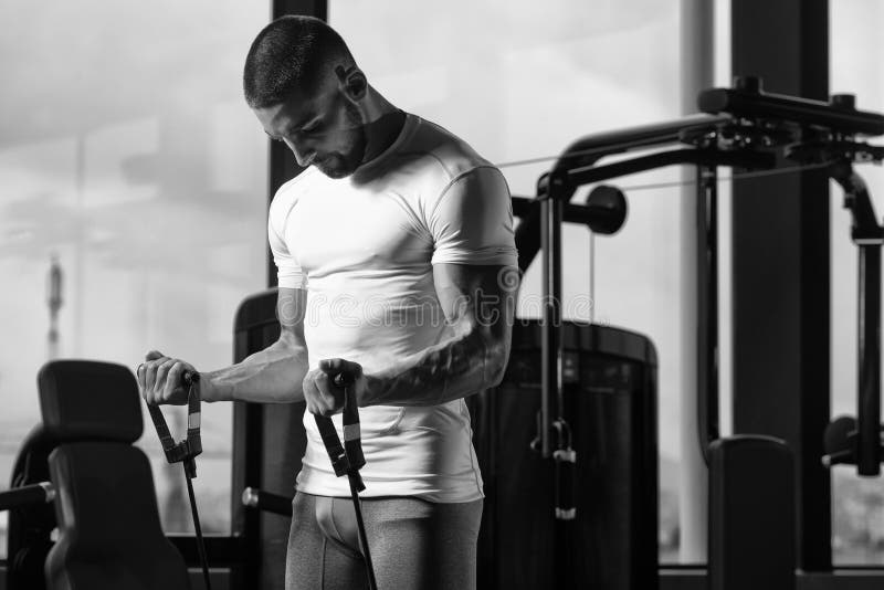 Biceps Exercising with Pull Rope Elastic Cable Stock Image - Image of ...