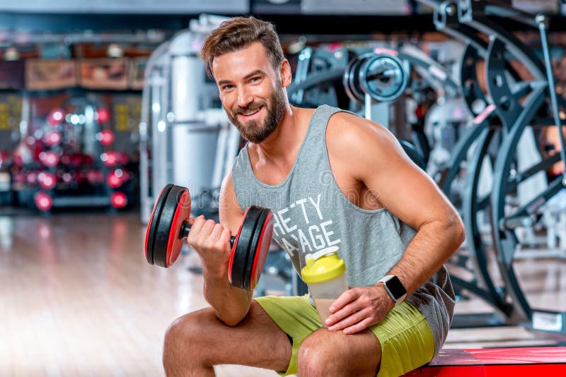 Man in the gym stock photo. Image of dumbbell, muscular - 81777524